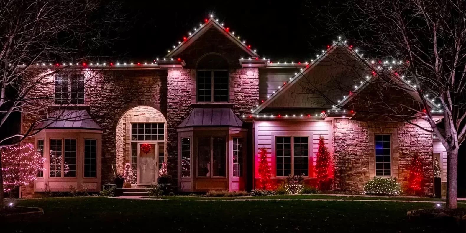 Red and white christmas lights on house store
